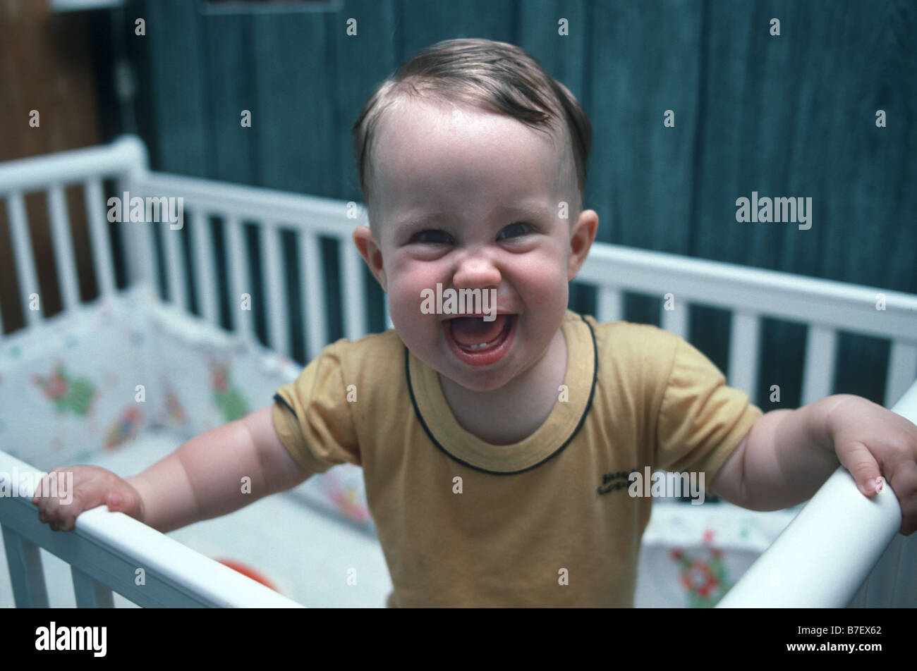 Happy baby girl in her crib Stock Photo - Alamy