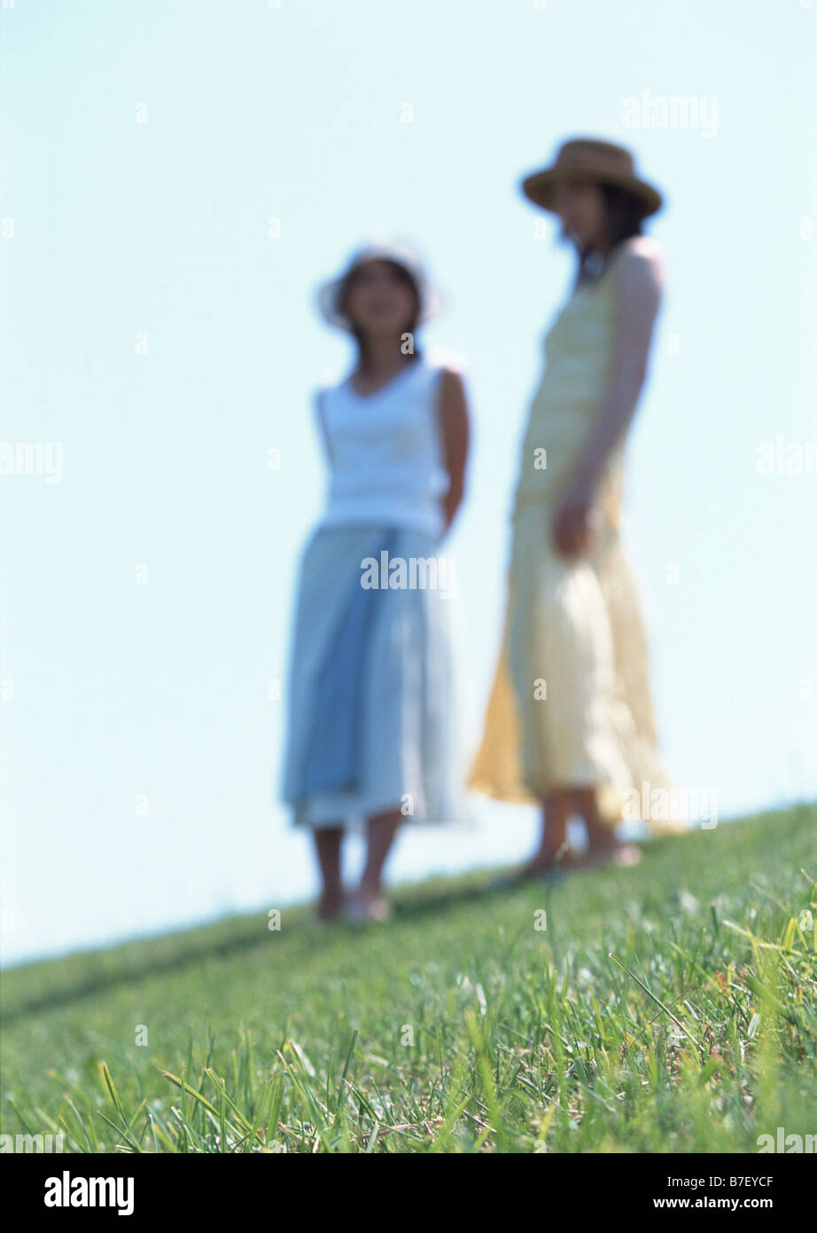 Women standing in field Stock Photo - Alamy