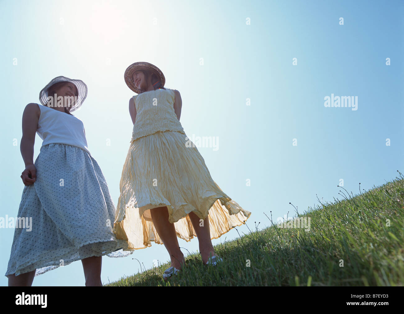 Women standing in field Stock Photo - Alamy