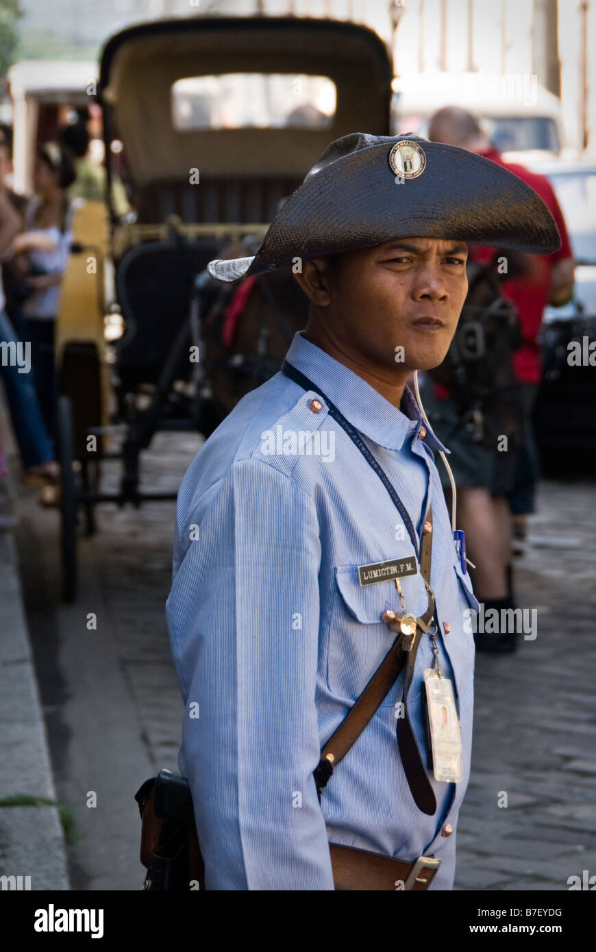 Uniformed guard outside San Augustin Church in Intramuros, Manila ...