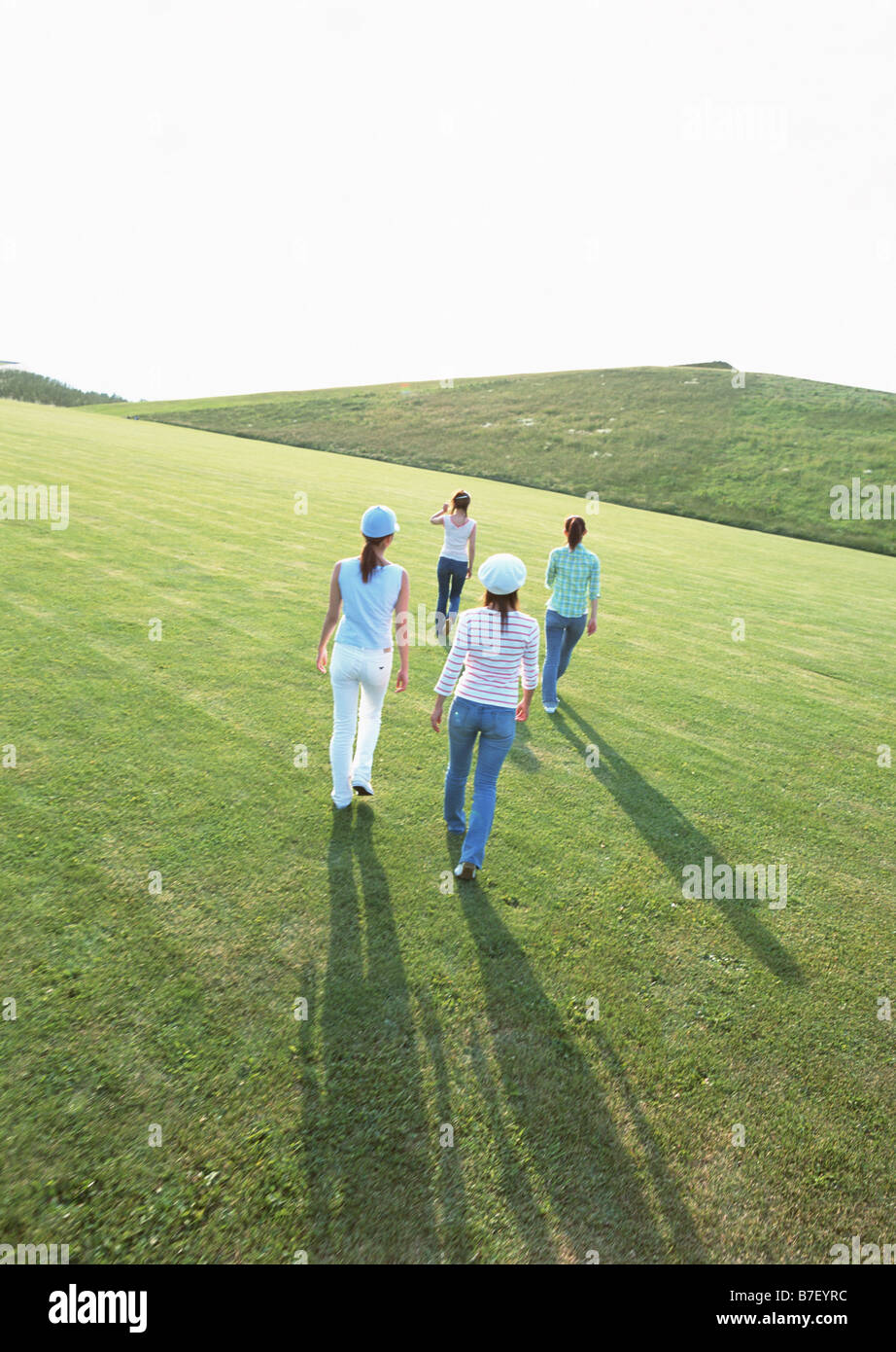 Women standing in field Stock Photo - Alamy