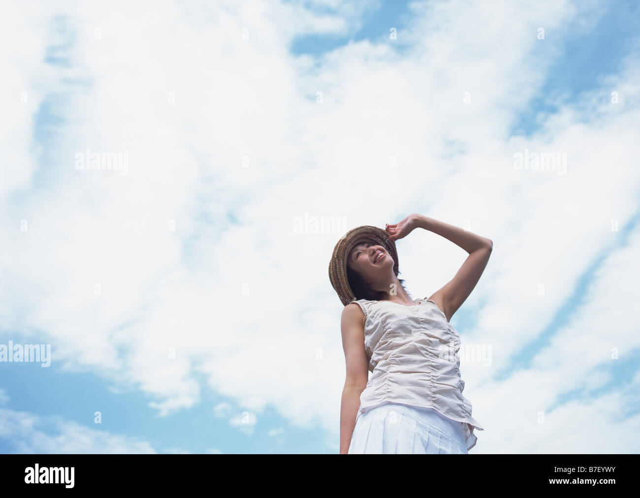 Woman and sky Stock Photo - Alamy