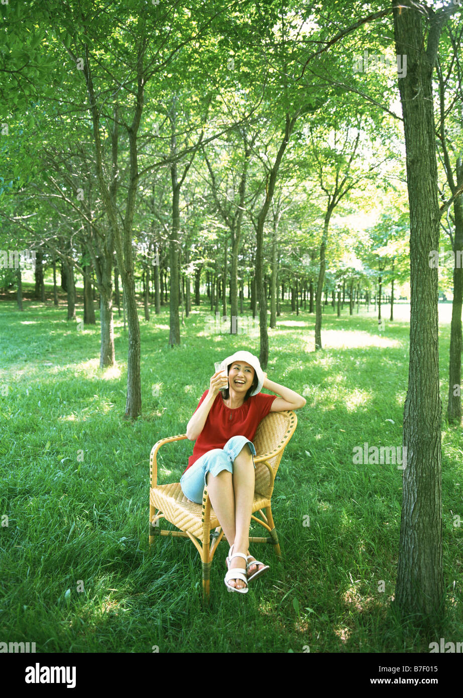 Woman rest in shade of tree Stock Photo - Alamy