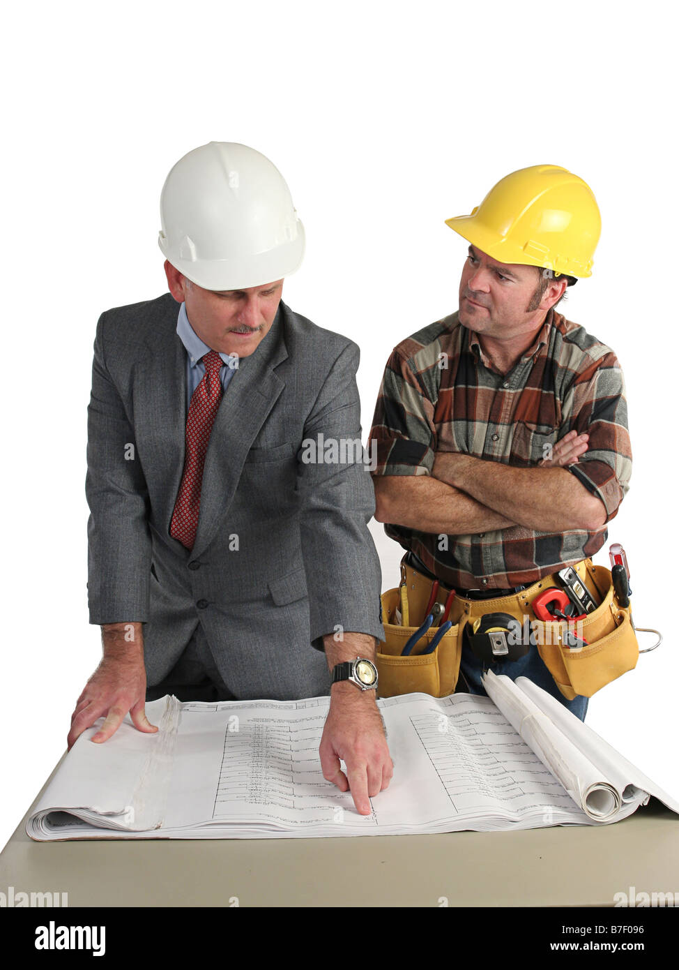 an engineer explaining the blueprints to the construction foreman ...