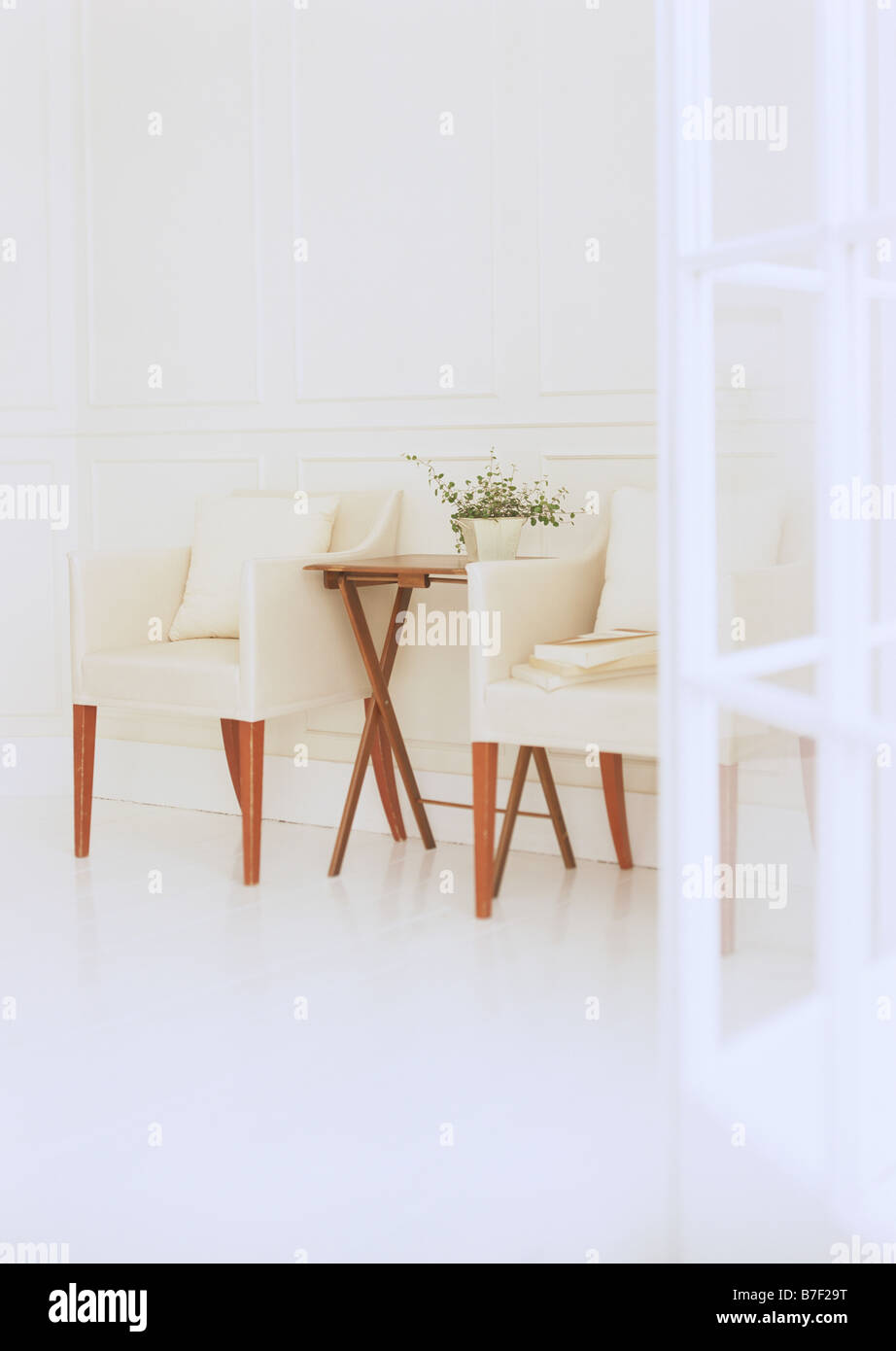 Table set by wall Stock Photo - Alamy