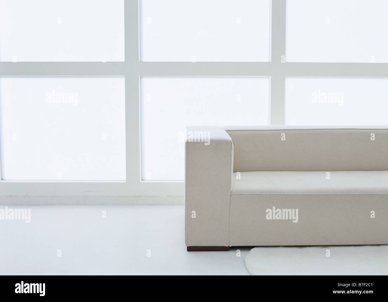 Sofa by window Stock Photo - Alamy