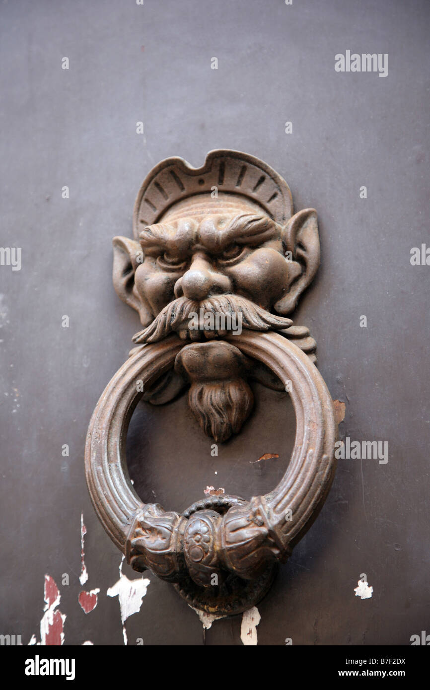 old metal handle with a ring on a door Stock Photo - Alamy