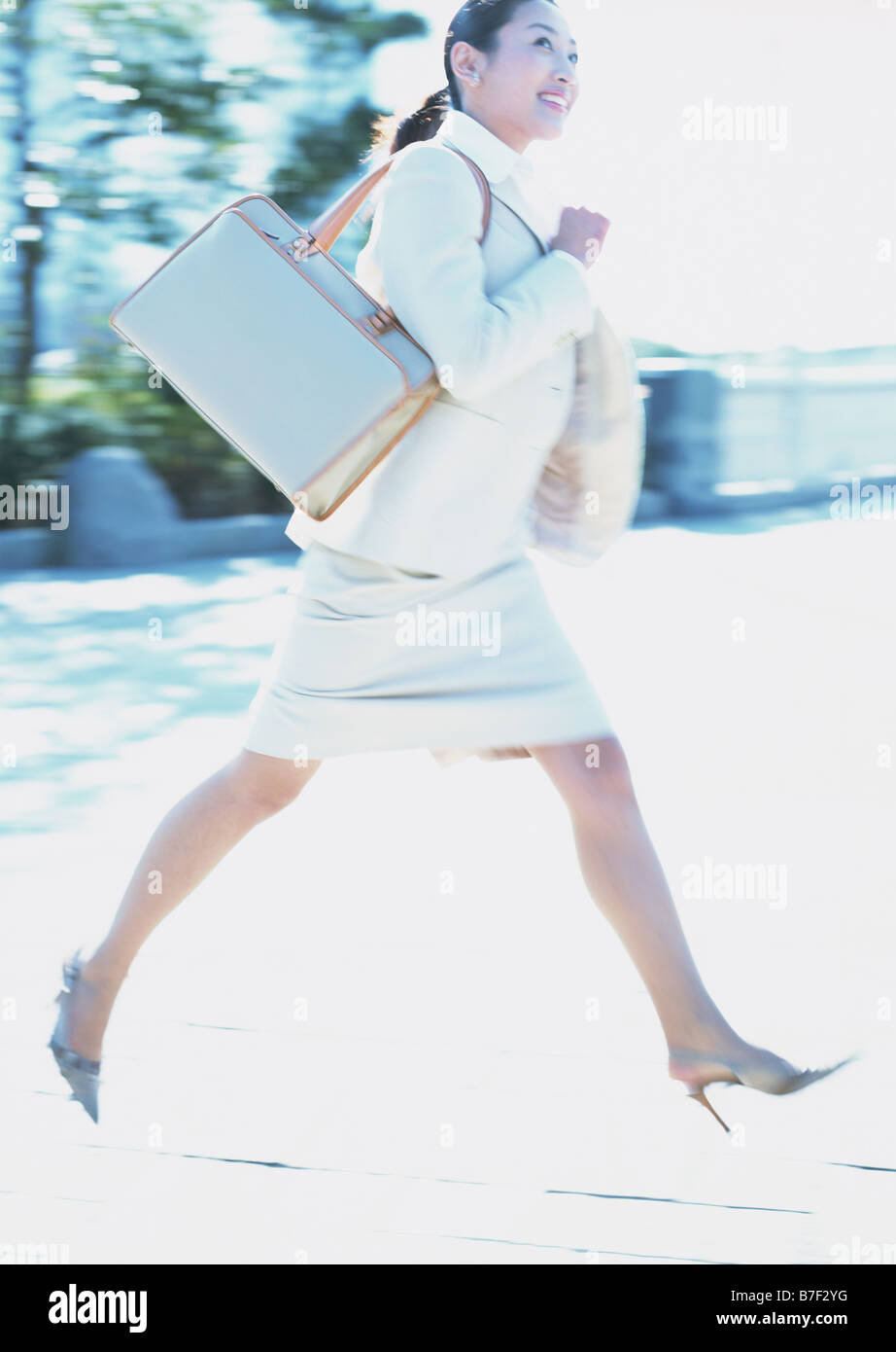 Business woman in a hurry Stock Photo - Alamy