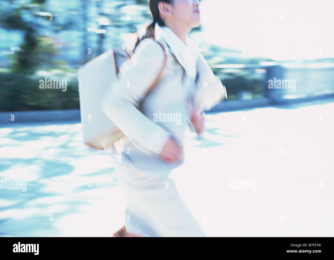 Business woman in a hurry Stock Photo - Alamy