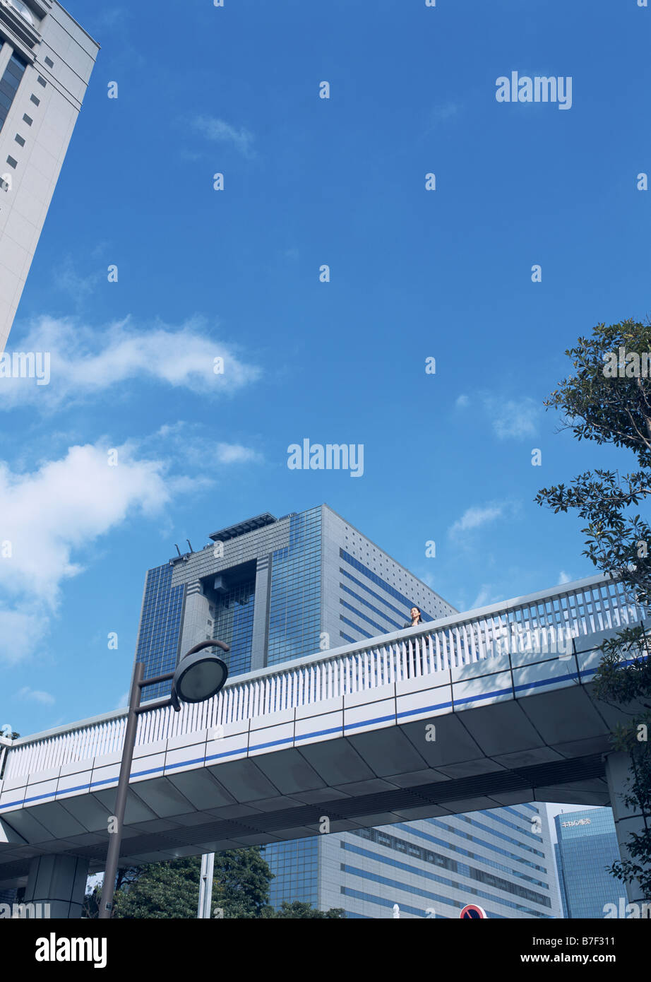 Tall building and skywalk Stock Photo - Alamy