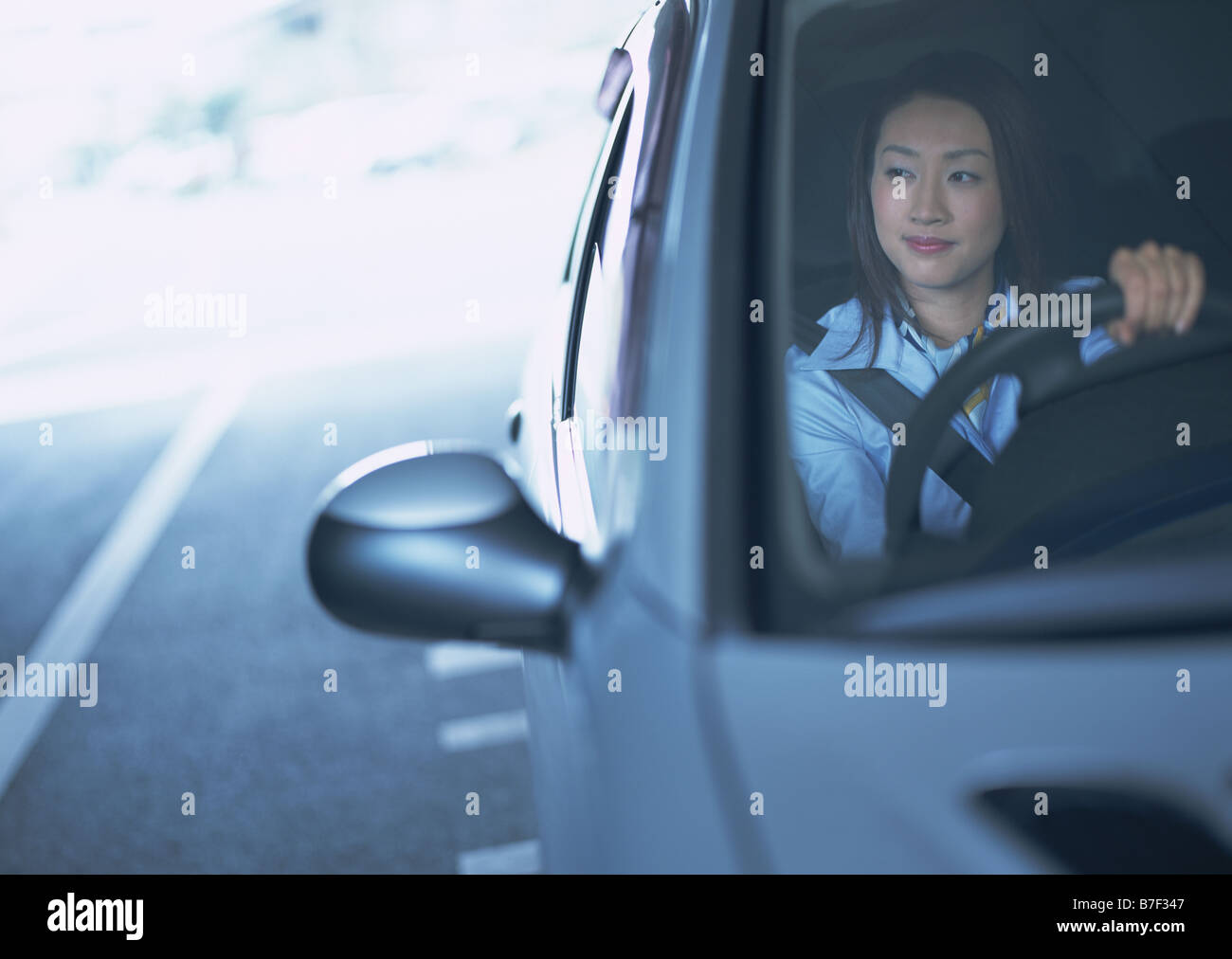 Business woman driving a car Stock Photo - Alamy