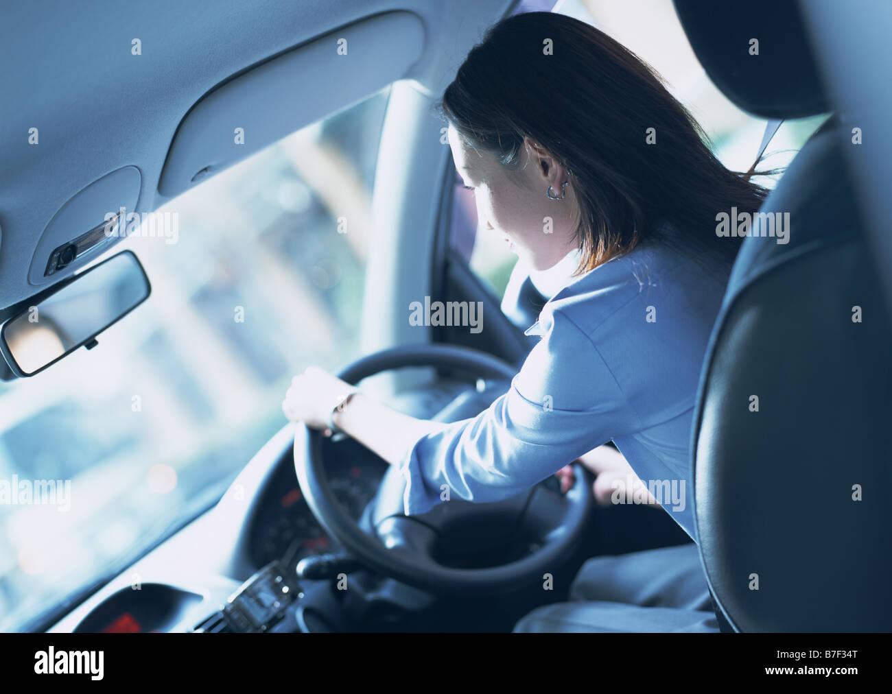 Business woman driving a car Stock Photo - Alamy