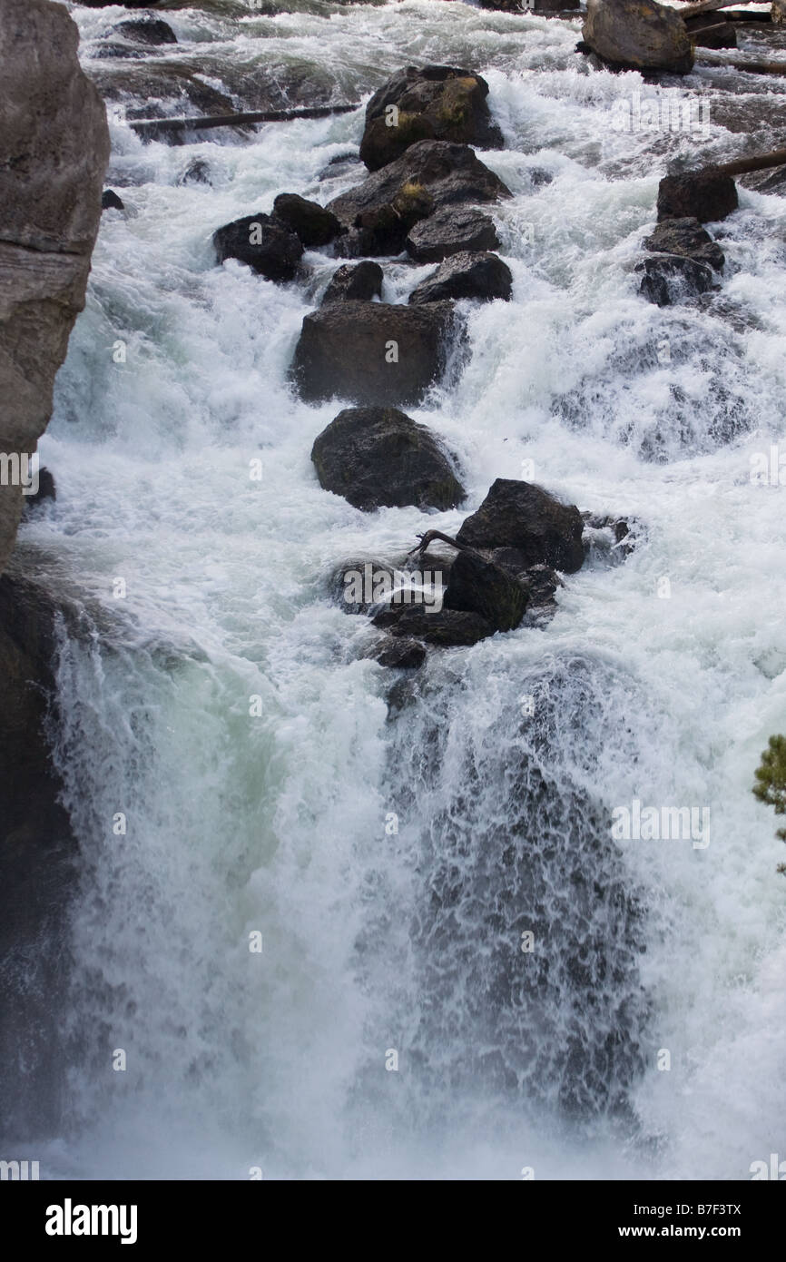 Water pours over rocks in Yellowstone Stock Photo - Alamy