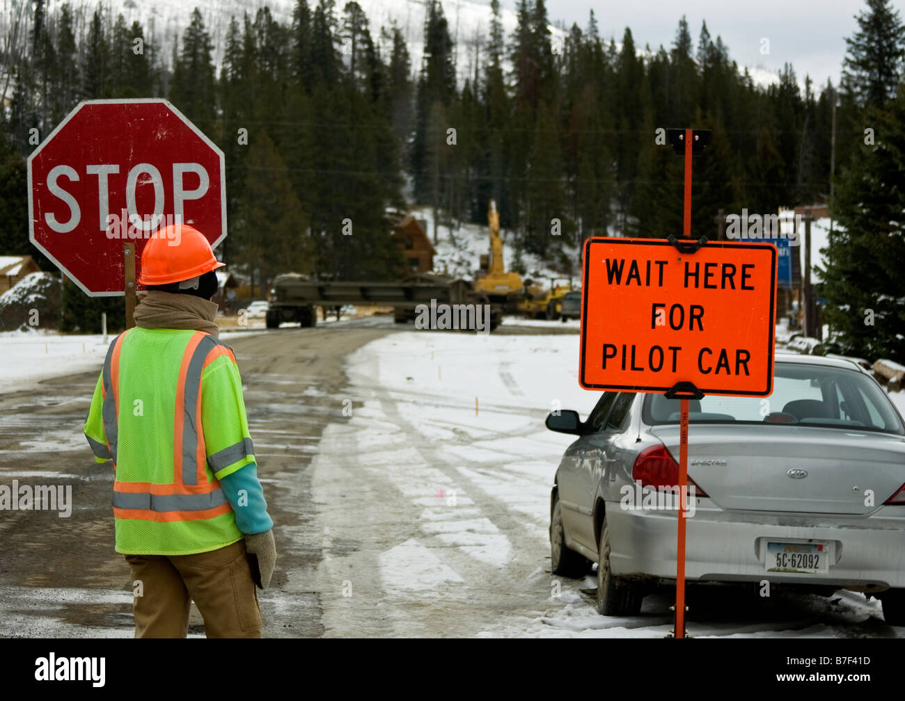 A construction worker holds a stop sign in a construction zone in ...