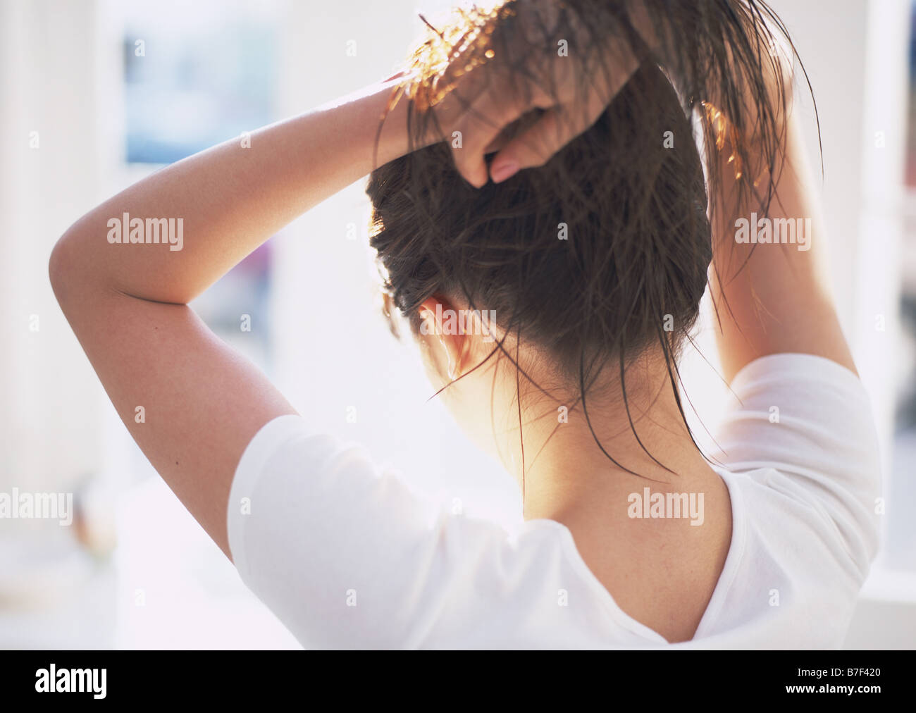 Hair pulled back hi-res stock photography and images - Alamy