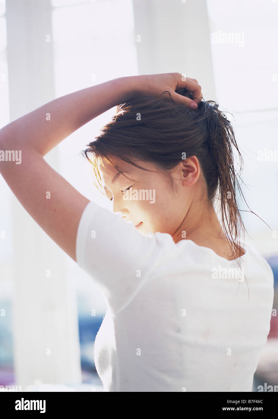 Woman with hair pulled back Stock Photo - Alamy