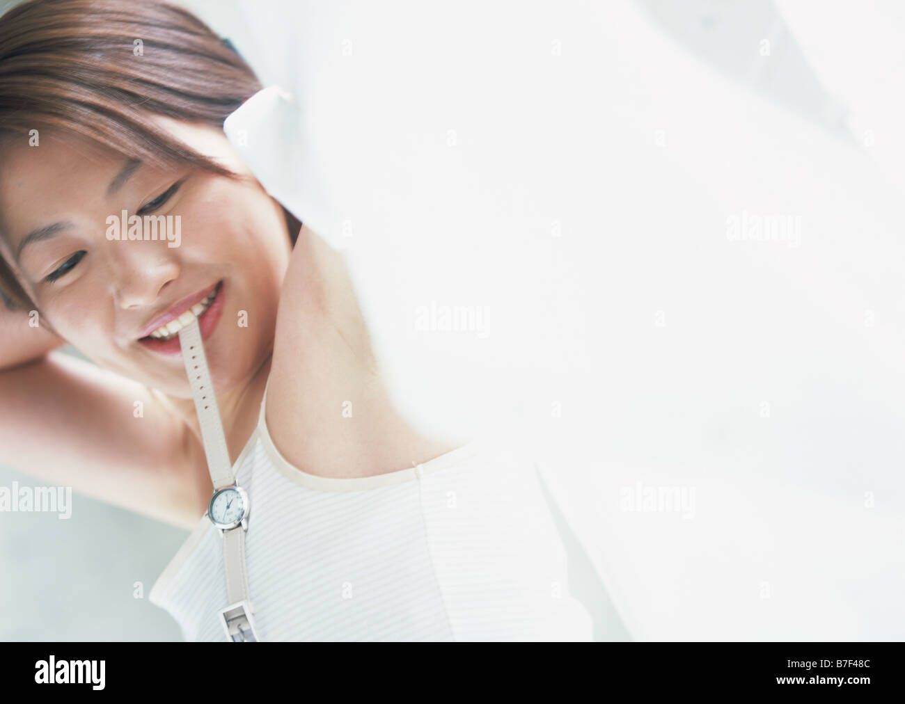 Woman getting dressed Stock Photo - Alamy