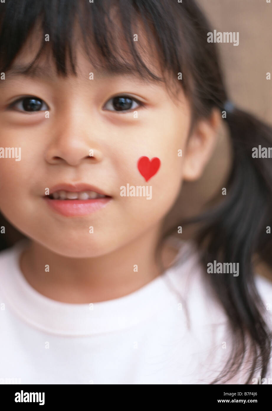 A heart on cheek Stock Photo - Alamy