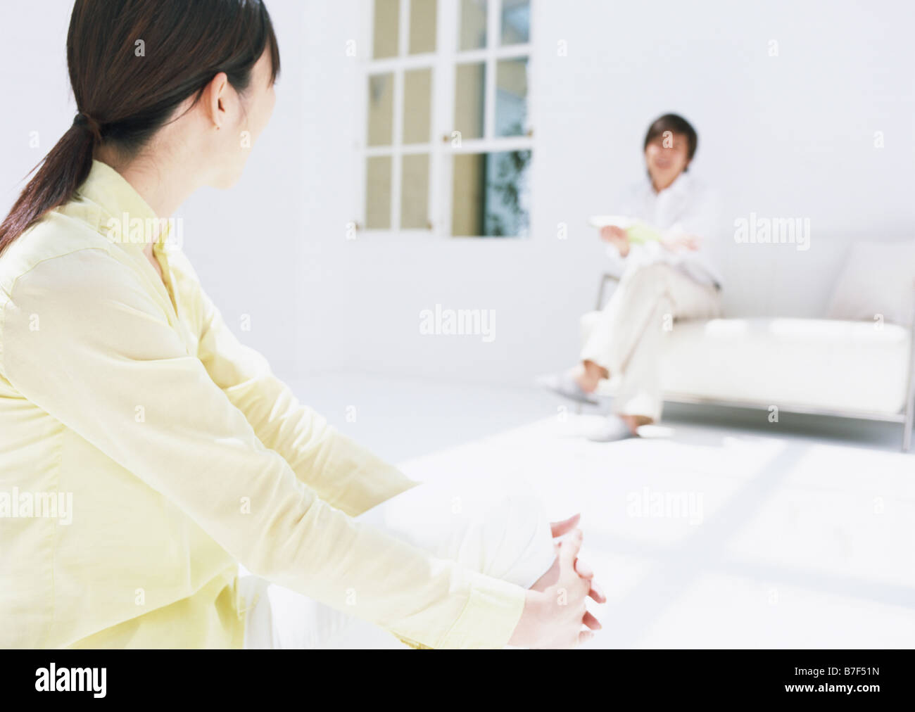 A couple talking in room Stock Photo - Alamy