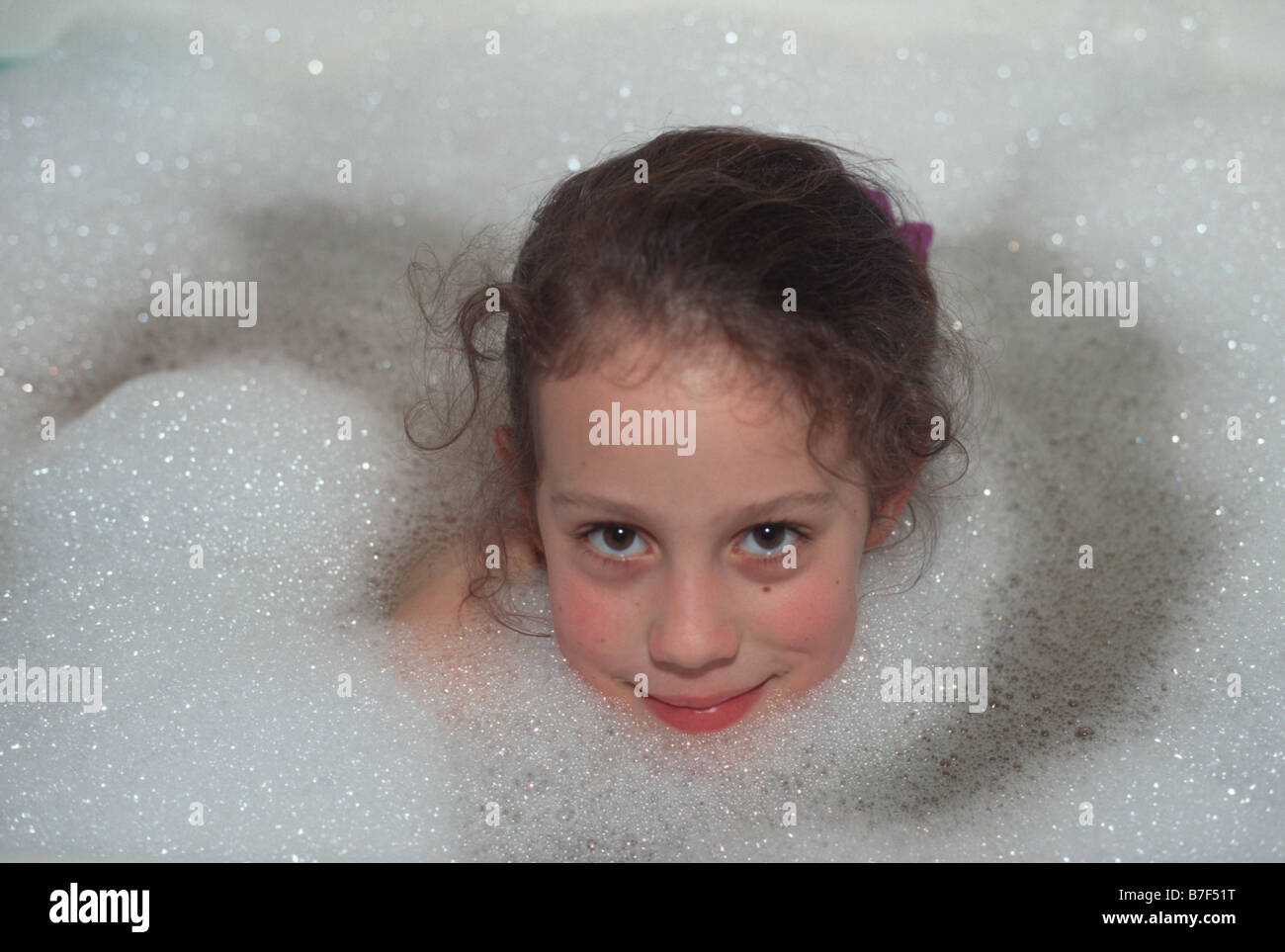 Portrait of a child in a bubble bath Stock Photo - Alamy