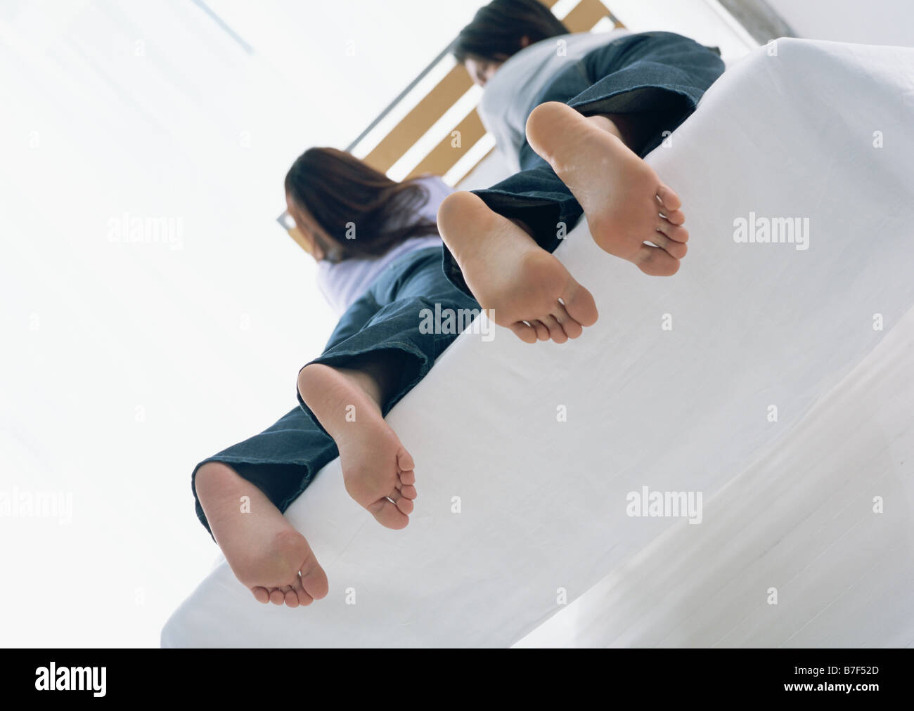A couple relaxed on bed Stock Photo - Alamy