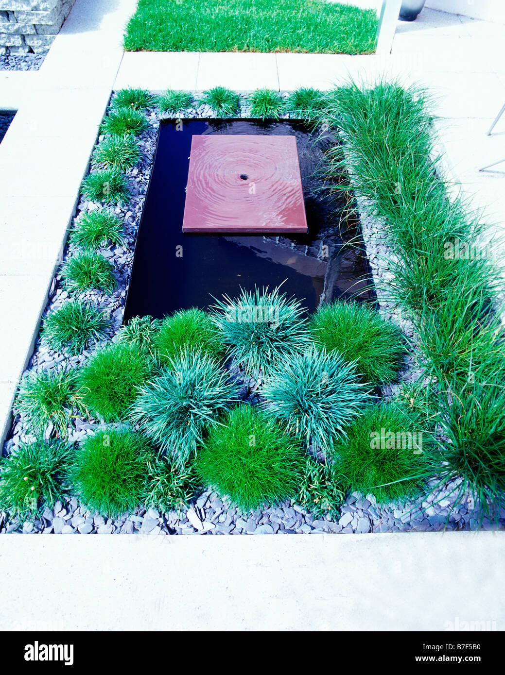 ATTRACTIVE STONE AND GLASS WATER FEATURE Stock Photo - Alamy