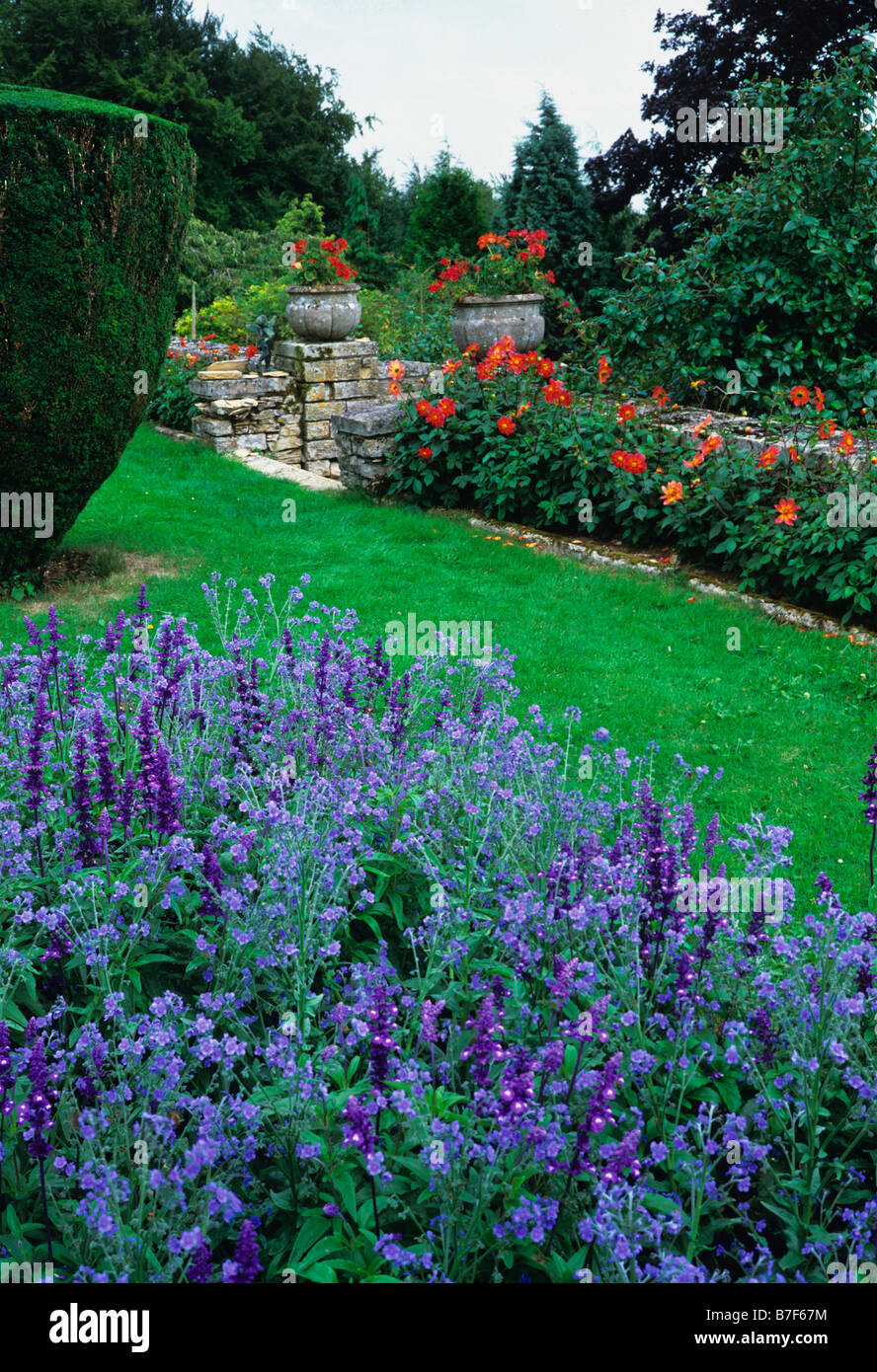 A striking blue and red borders at Cotswold Farm Stock Photo - Alamy