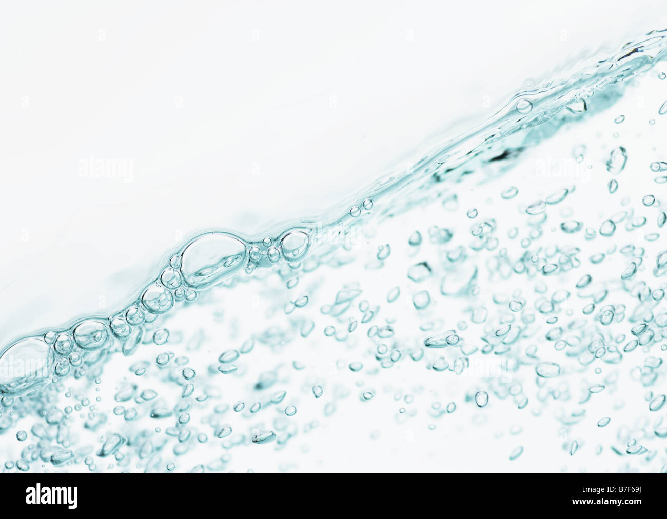 Wave motion and water bubbles Stock Photo - Alamy