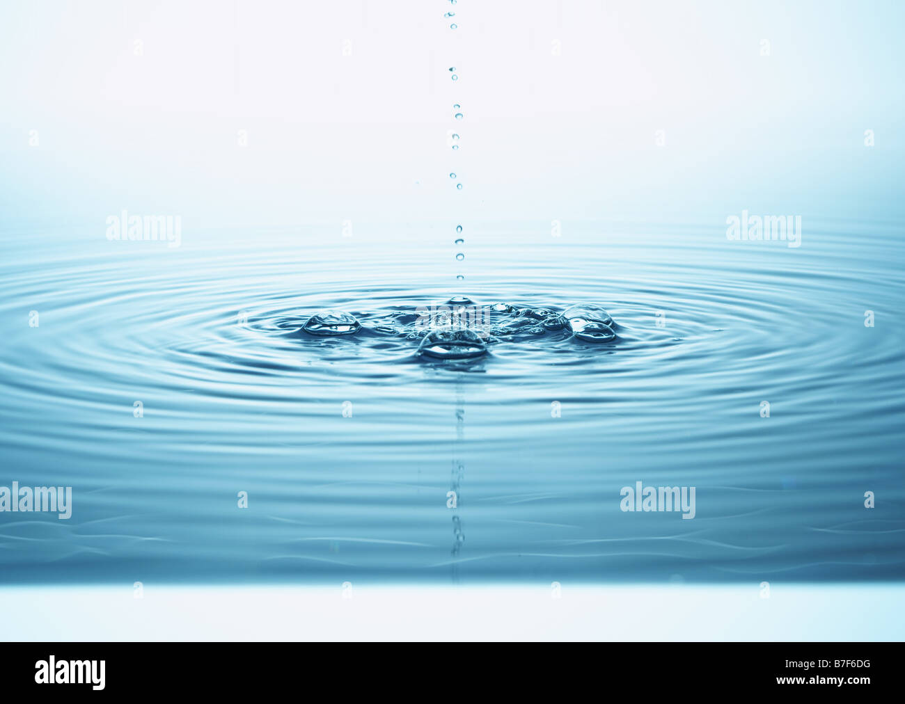 Ripple and water drops Stock Photo - Alamy