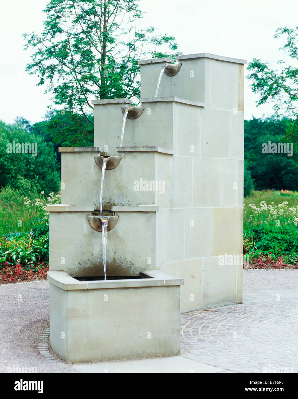 tiered water feature based on cut stone Stock Photo - Alamy