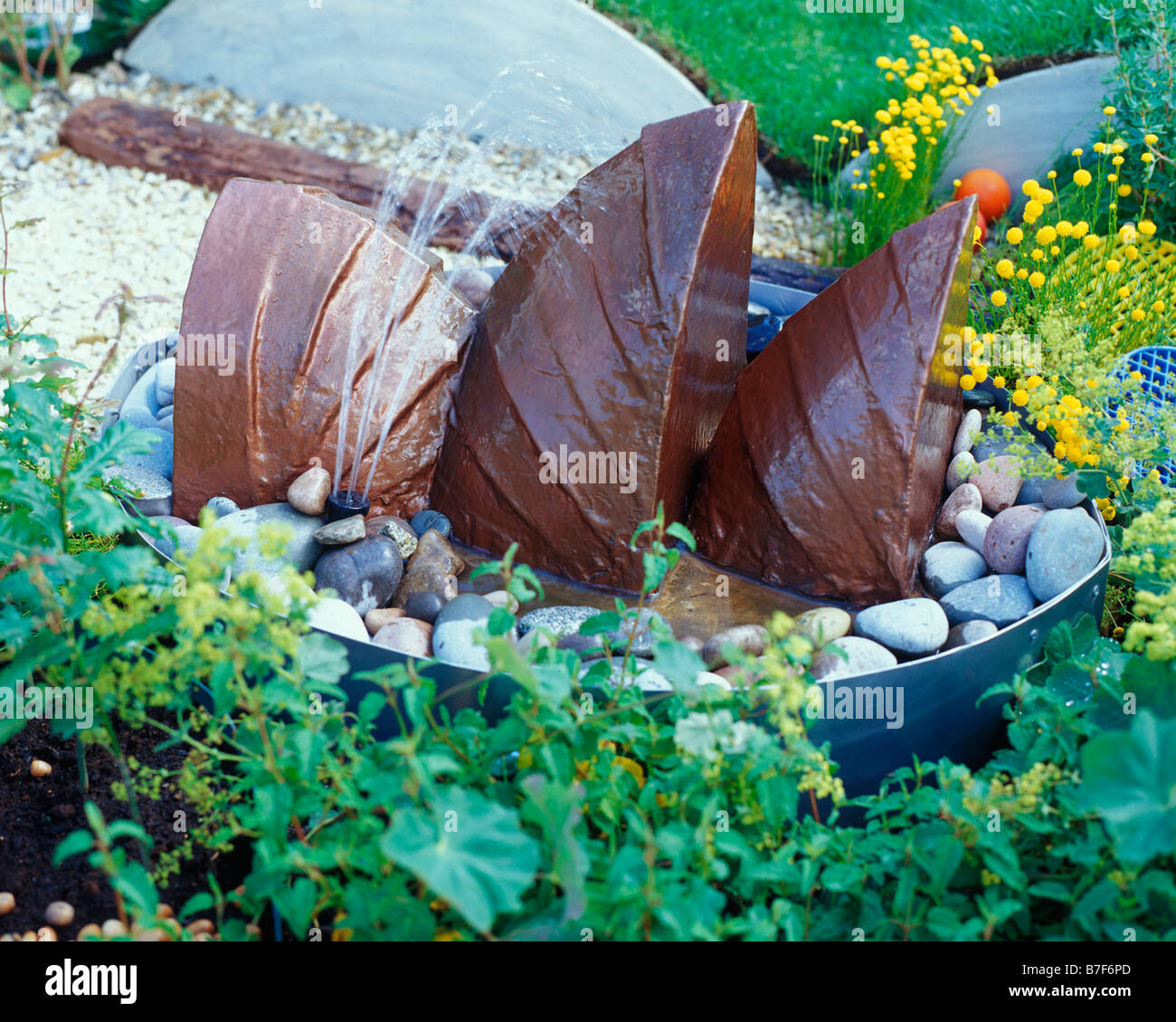 MODERN WATER FEATURE BASED ON METAL AND STONE Stock Photo - Alamy