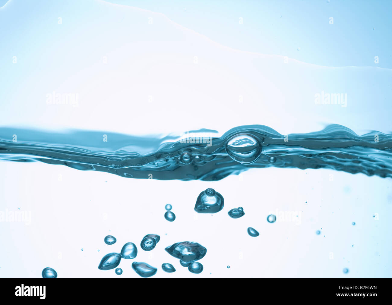 Wave motion and water bubbles Stock Photo - Alamy