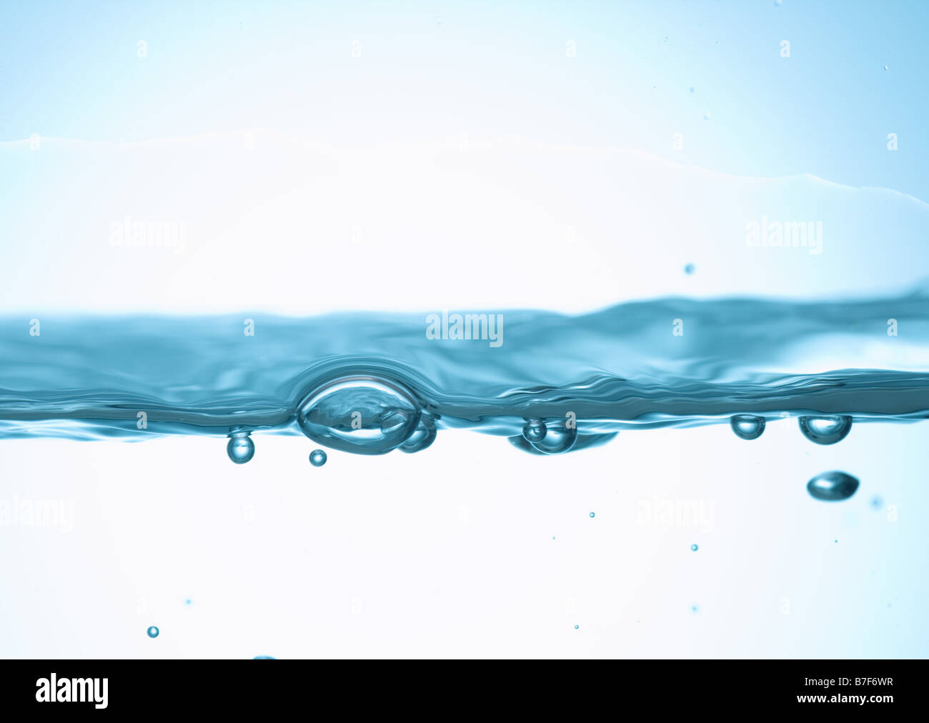 Wave motion and water bubbles Stock Photo - Alamy