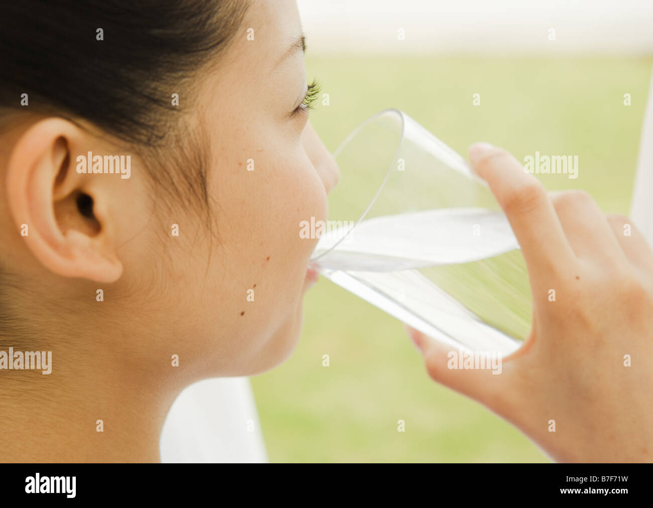 Woman drinking water Stock Photo - Alamy