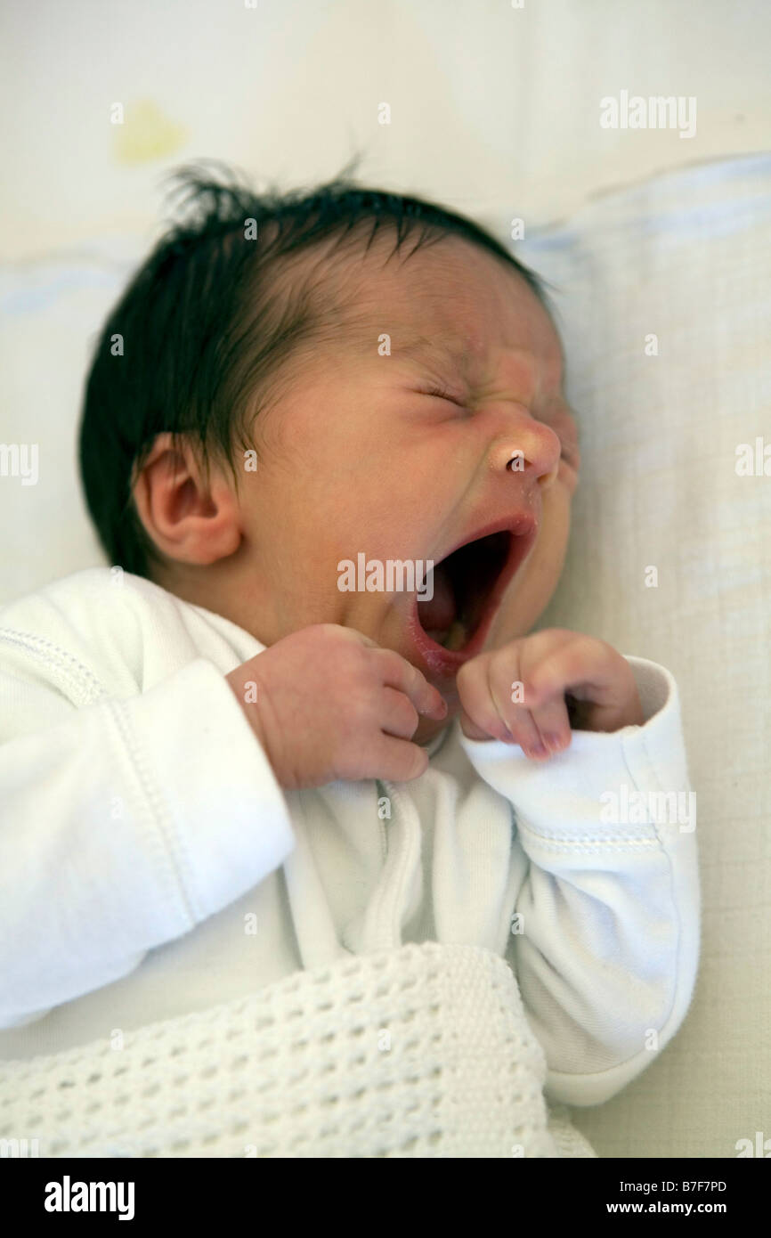 A newborn baby yawning Stock Photo - Alamy