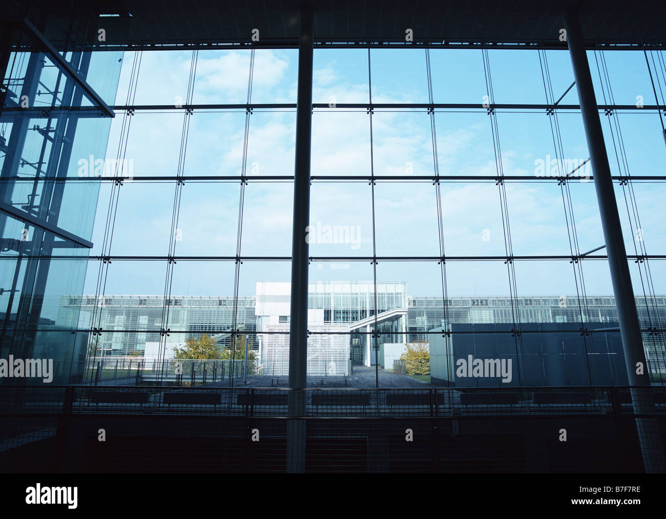 Inside of glass-walled building Stock Photo - Alamy