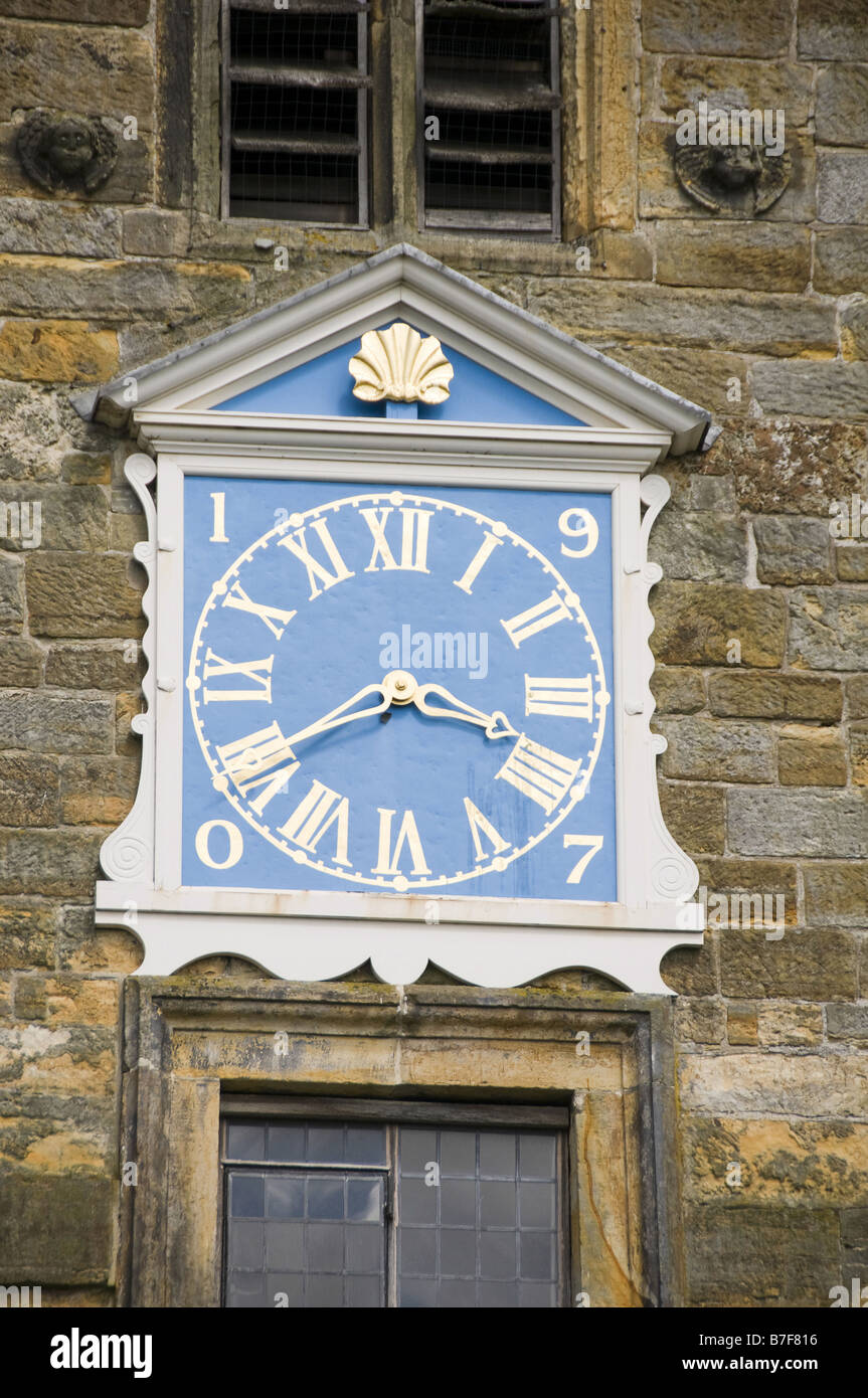 A blue clock on church tower Stock Photo - Alamy