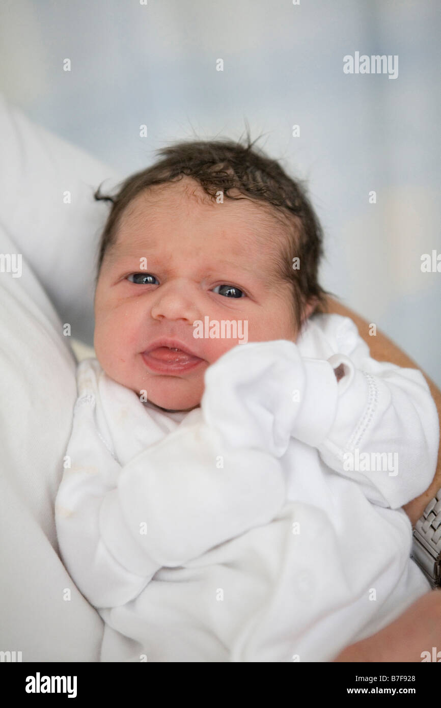 A newborn baby in her mothers arms Stock Photo - Alamy