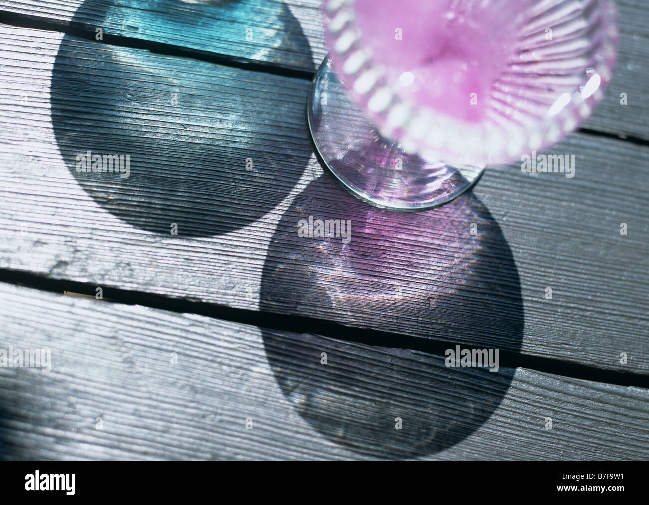 Colored ice cubes in glasses and its shade Stock Photo - Alamy