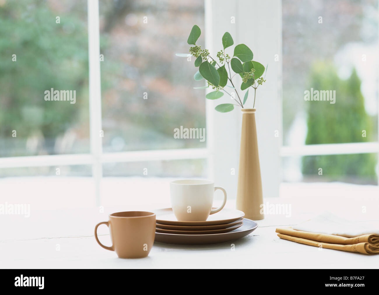 Table at window Stock Photo - Alamy