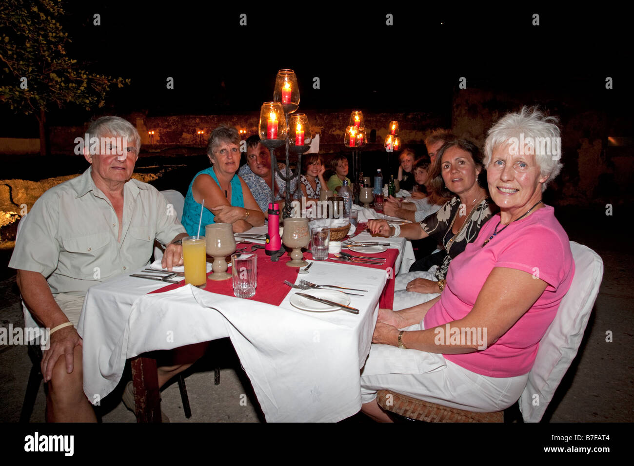 Family at dinner table in ruins sound and light show at night Fort ...