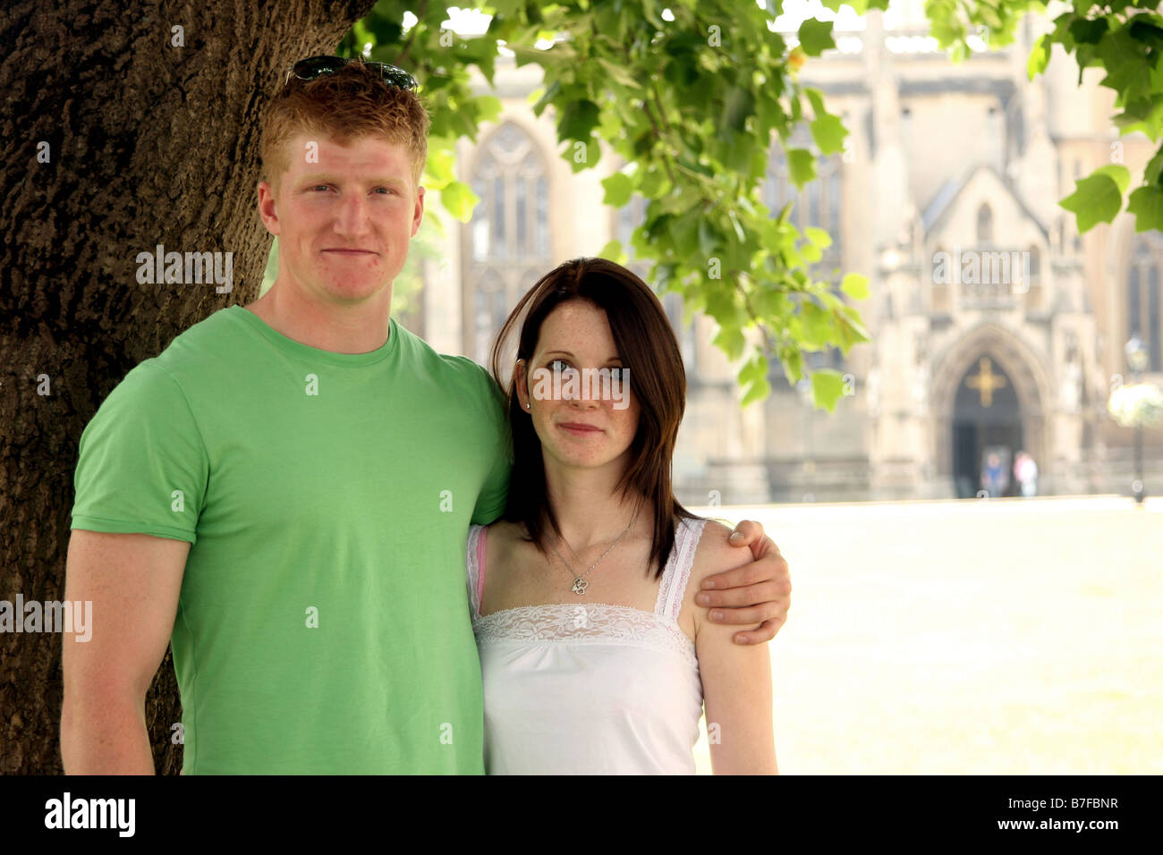Teen lovers under a tree Stock Photo - Alamy