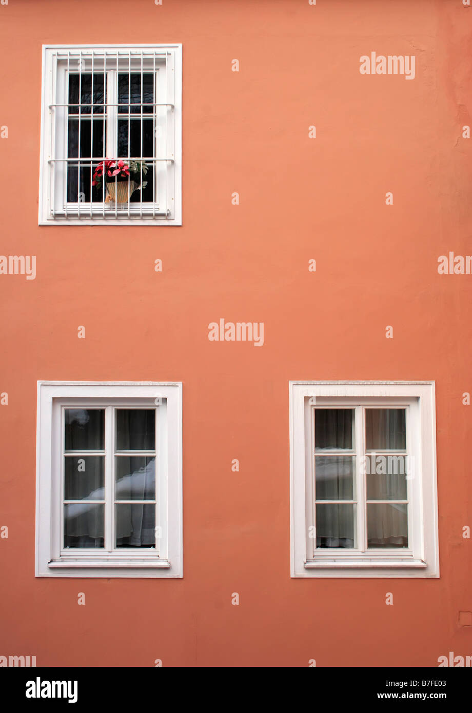 House wall with three windows Stock Photo - Alamy