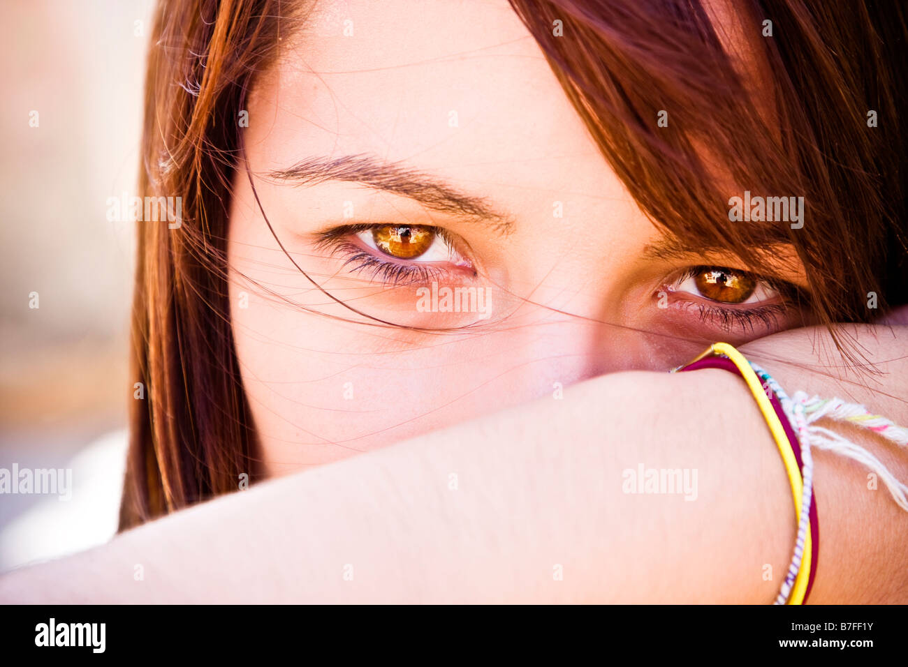 Young woman staring at camera Stock Photo - Alamy