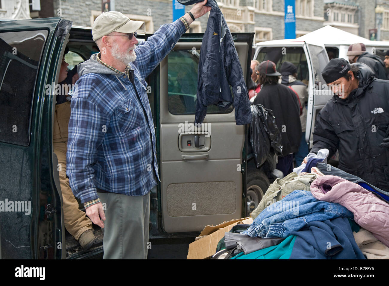 Church Members Distribute Donated Coats to the Homeless Stock Photo - Alamy