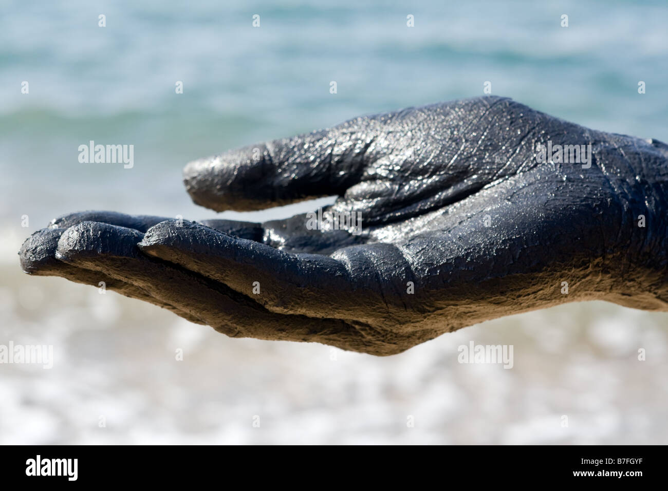 Hand covered with mud from Dead sea Jordan Skincare treatment Use of ...