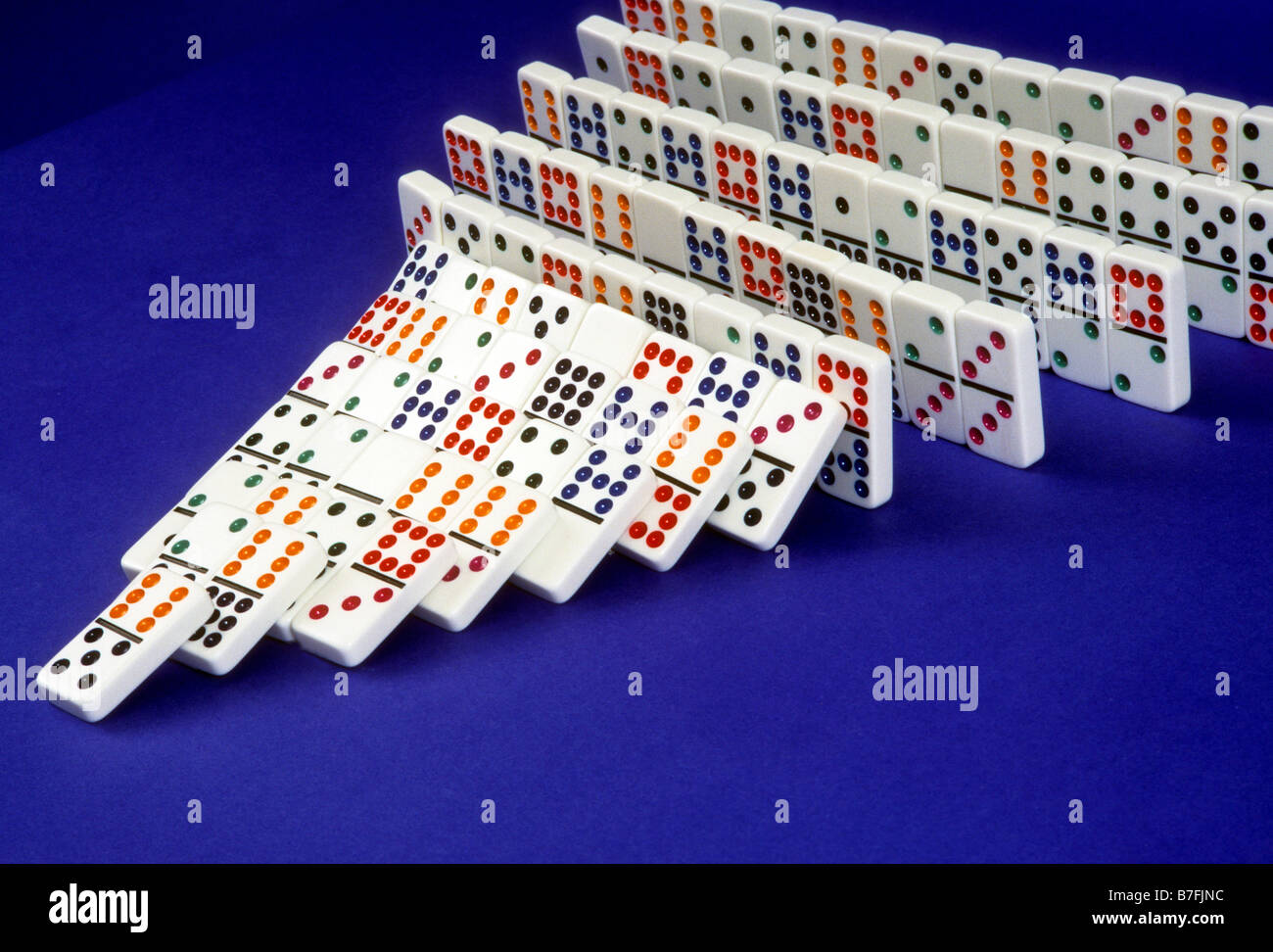 dominos fall increasing size of row each time Stock Photo - Alamy