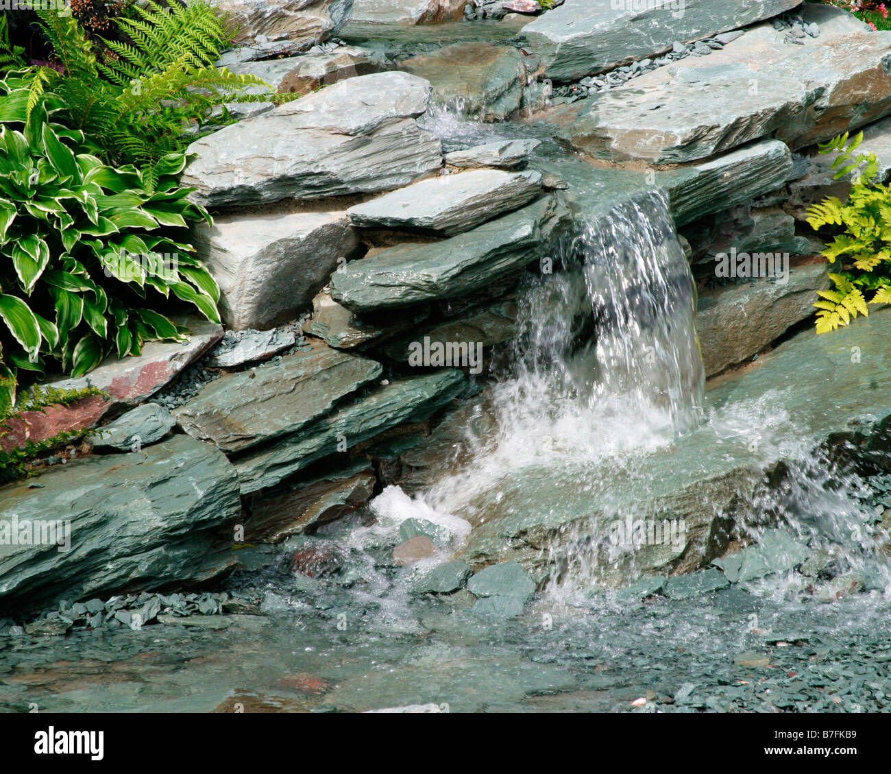 WATERFALL BASED ON GREY SLATE Stock Photo - Alamy