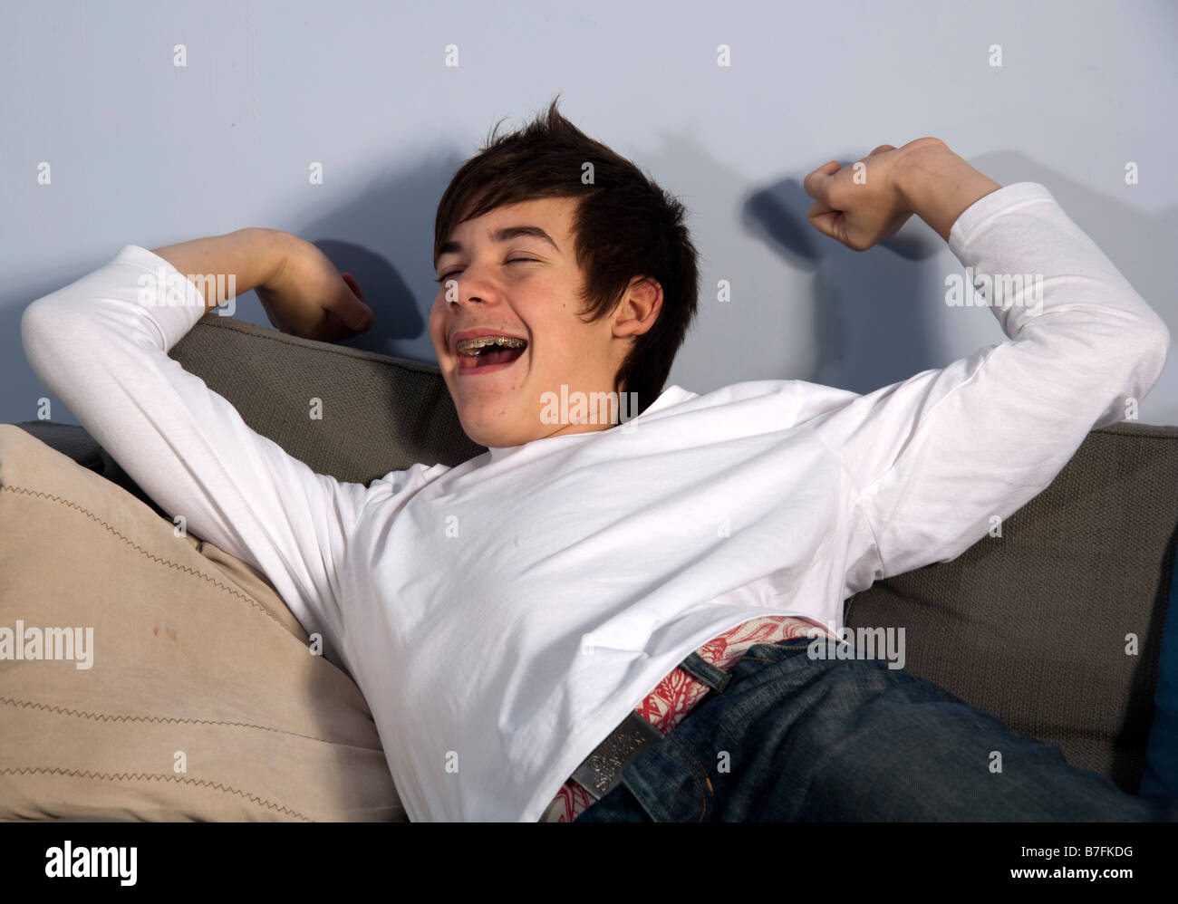 Teen boy sleeping on couch hi-res stock photography and images - Alamy