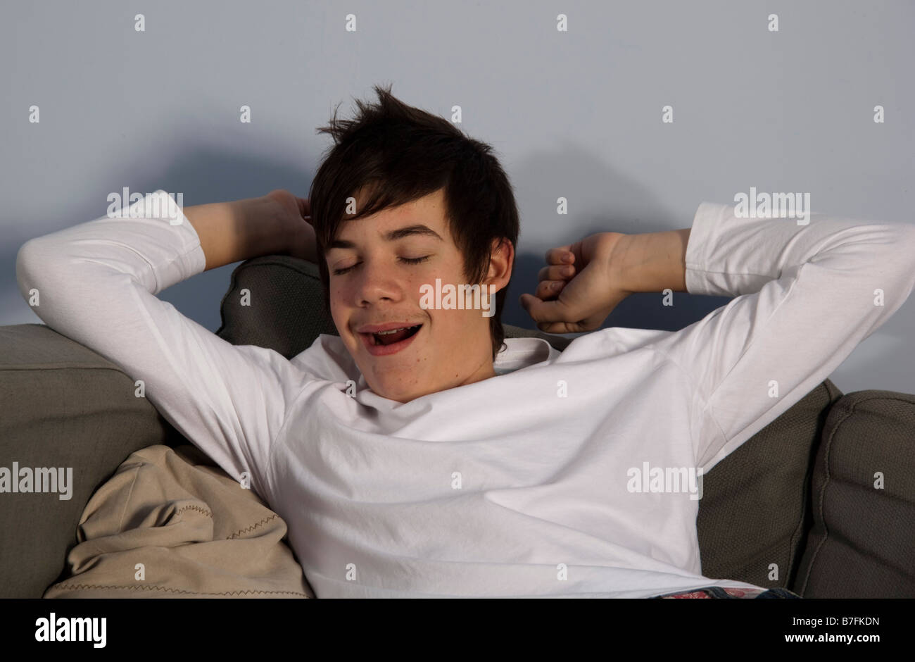 teenage boy sleeping on couch Stock Photo - Alamy